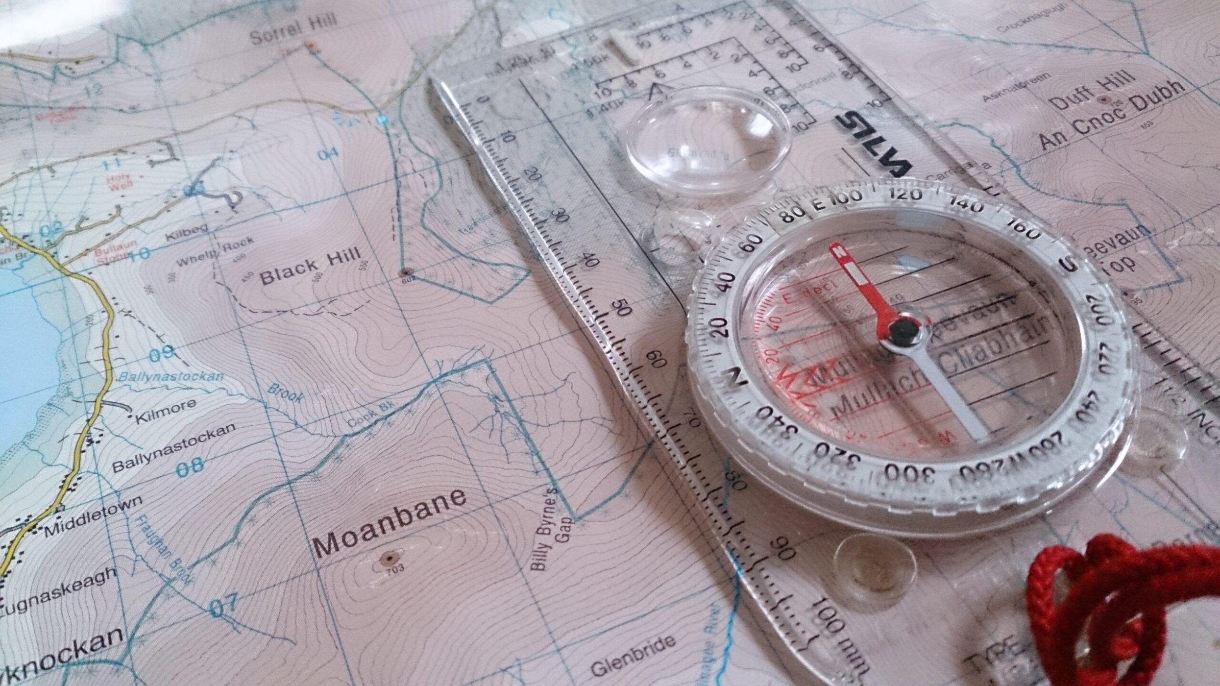 Taking a compass bearing from a map